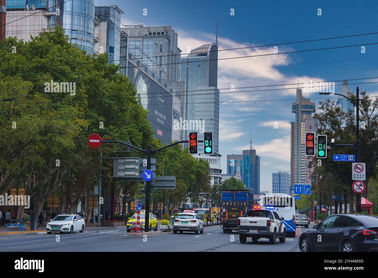Bustling Street Scene with Skyscrapers and Greenery in Shanghai Stock ...