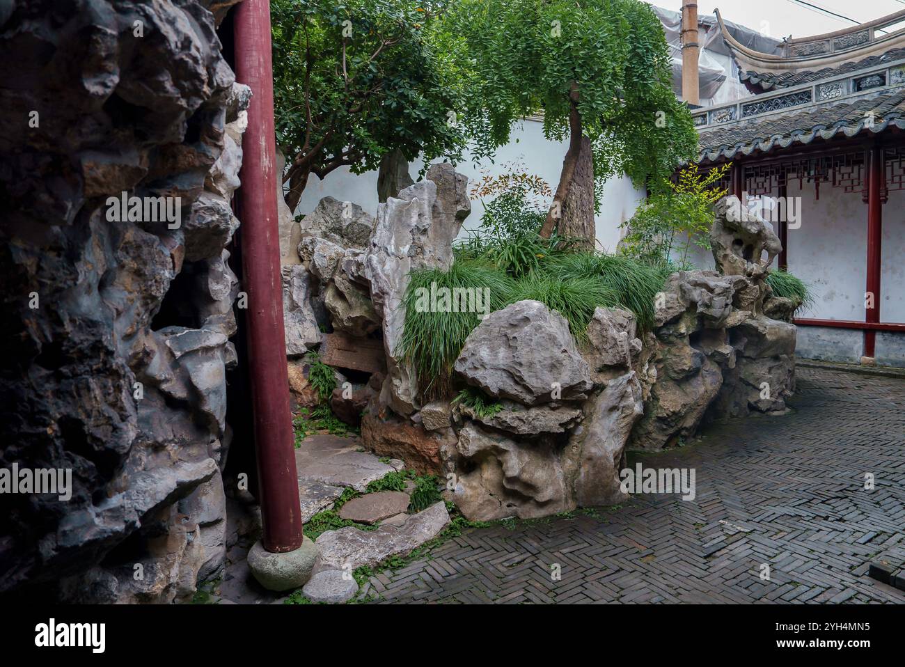 Traditional Chinese Garden with Rock Formations and Architecture Stock ...