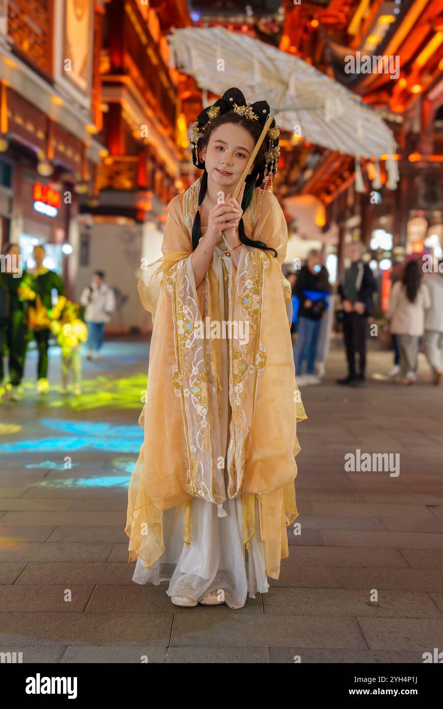 Person in Traditional Attire on Vibrant Street in Shanghai's Old Town ...
