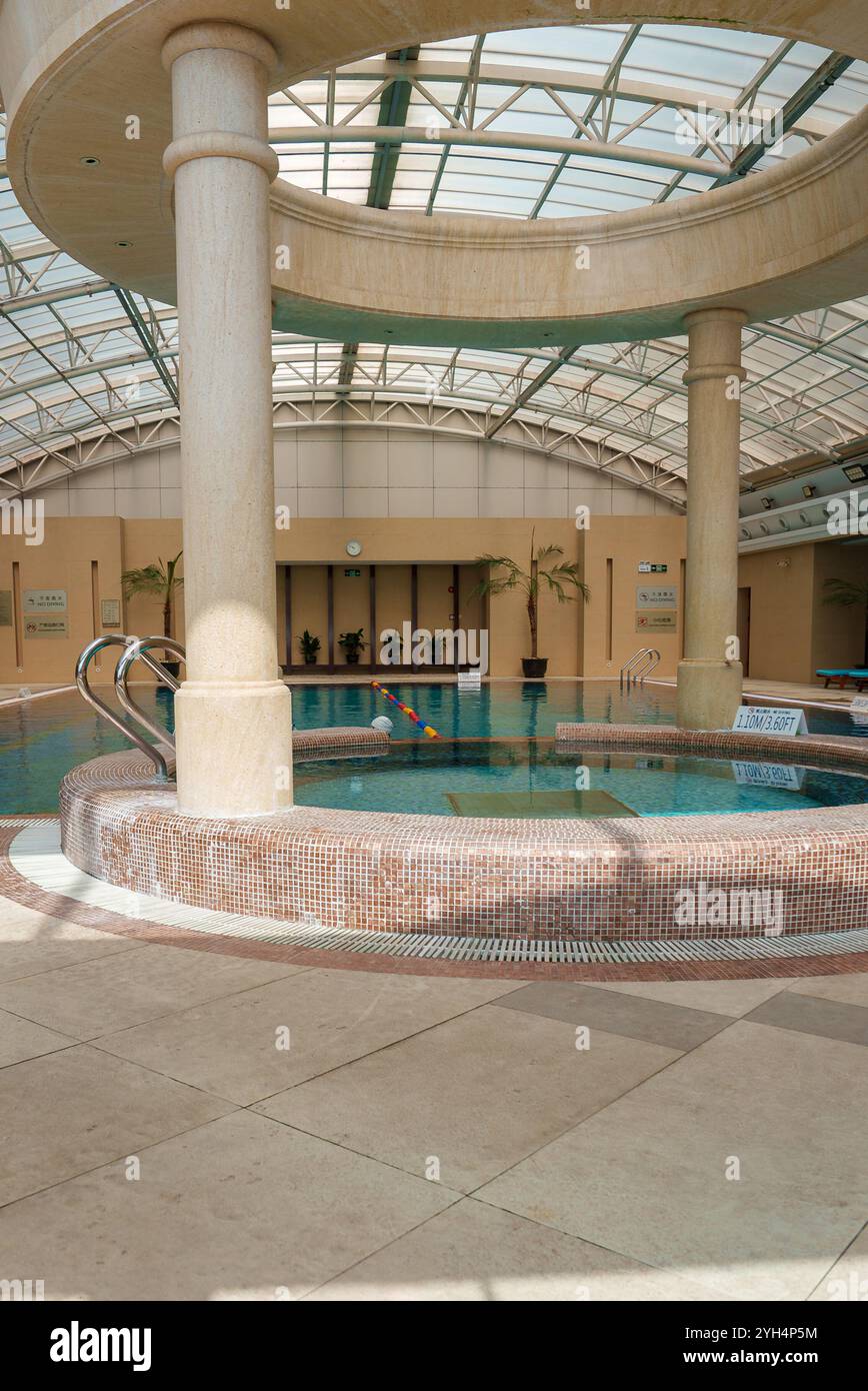 Indoor Swimming Pool with Glass Domed Ceiling and Beige Columns Stock ...