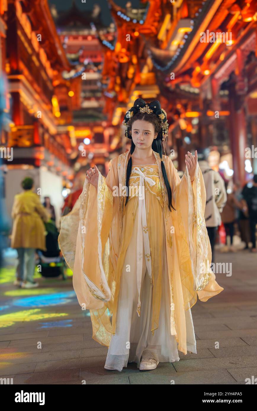 Traditional Attire in Shanghai's Old Town with Illuminated Street Stock ...