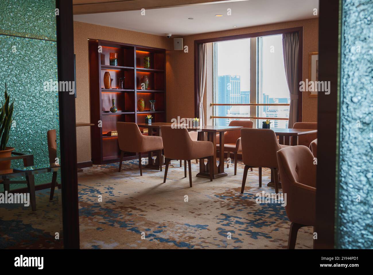 Elegant Lounge with View of Shanghai Skyline Through Large Windows ...
