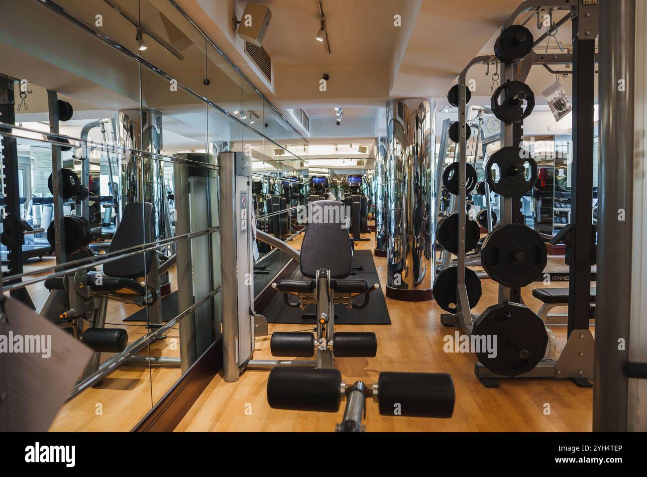 Modern Gym Interior with Weight Machines and Free Weights Stock Photo ...
