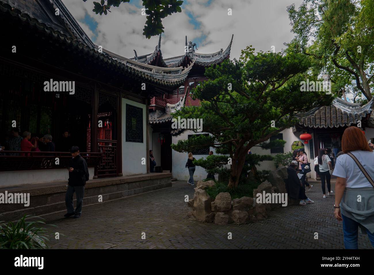 Traditional Chinese Garden with Visitors in Shanghai's Old Town Stock ...