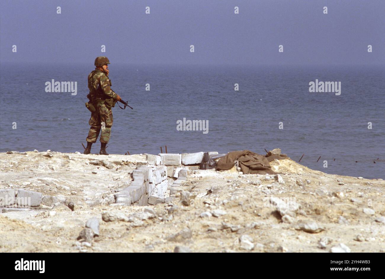 First Gulf War: 10th March 1991 An American soldier stands next to an ...