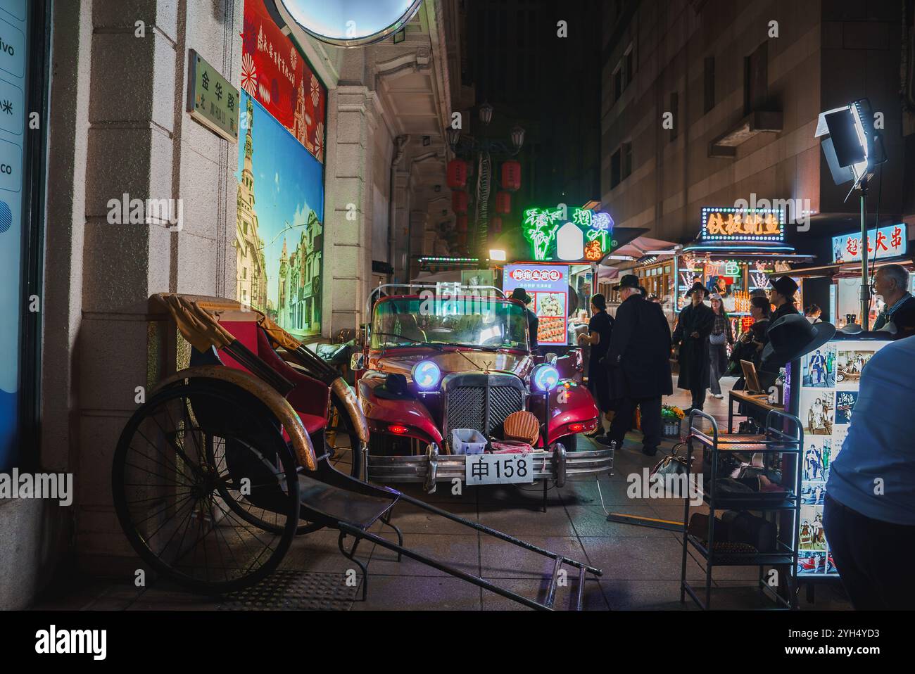 Vibrant Nighttime Street Scene in Shanghai with Vintage Car and ...