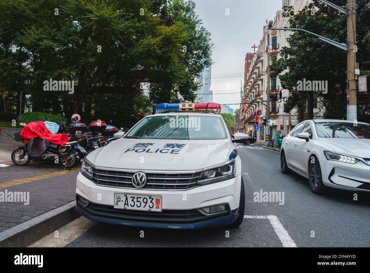 Street Scene in Shanghai with Police Car and Mixed Architecture Stock ...