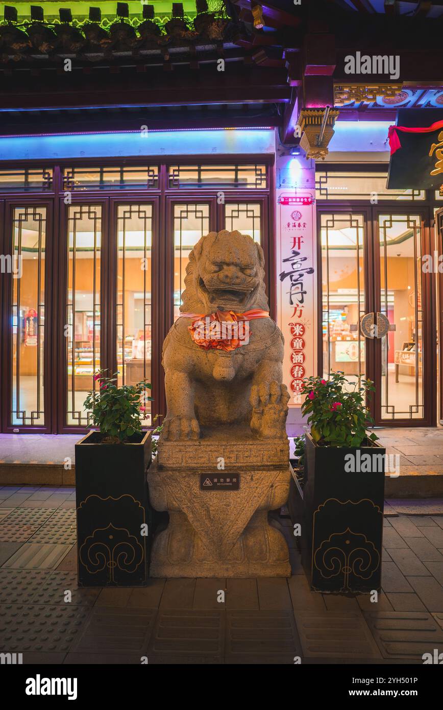 Traditional Chinese Stone Lion Statue with Red Ribbon in Shanghai Stock ...