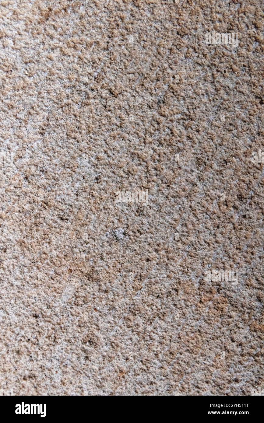 Close up photo of a granulated concrete rock texture split with ...