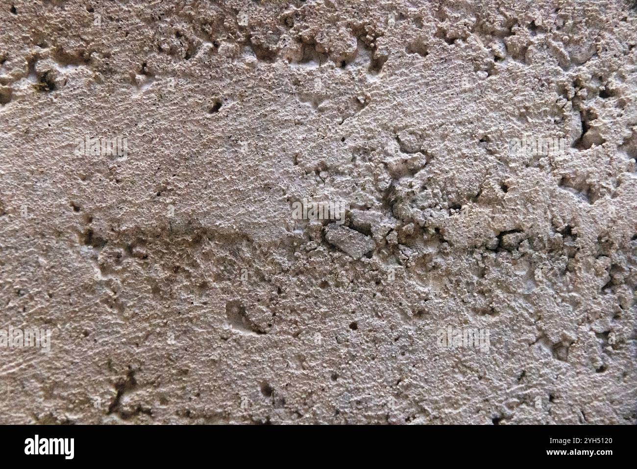 Close up photo of a granulated concrete rock texture split with ...