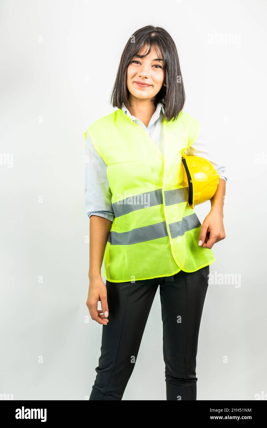 Woman wearing hardhat holding hi-res stock photography and images - Alamy