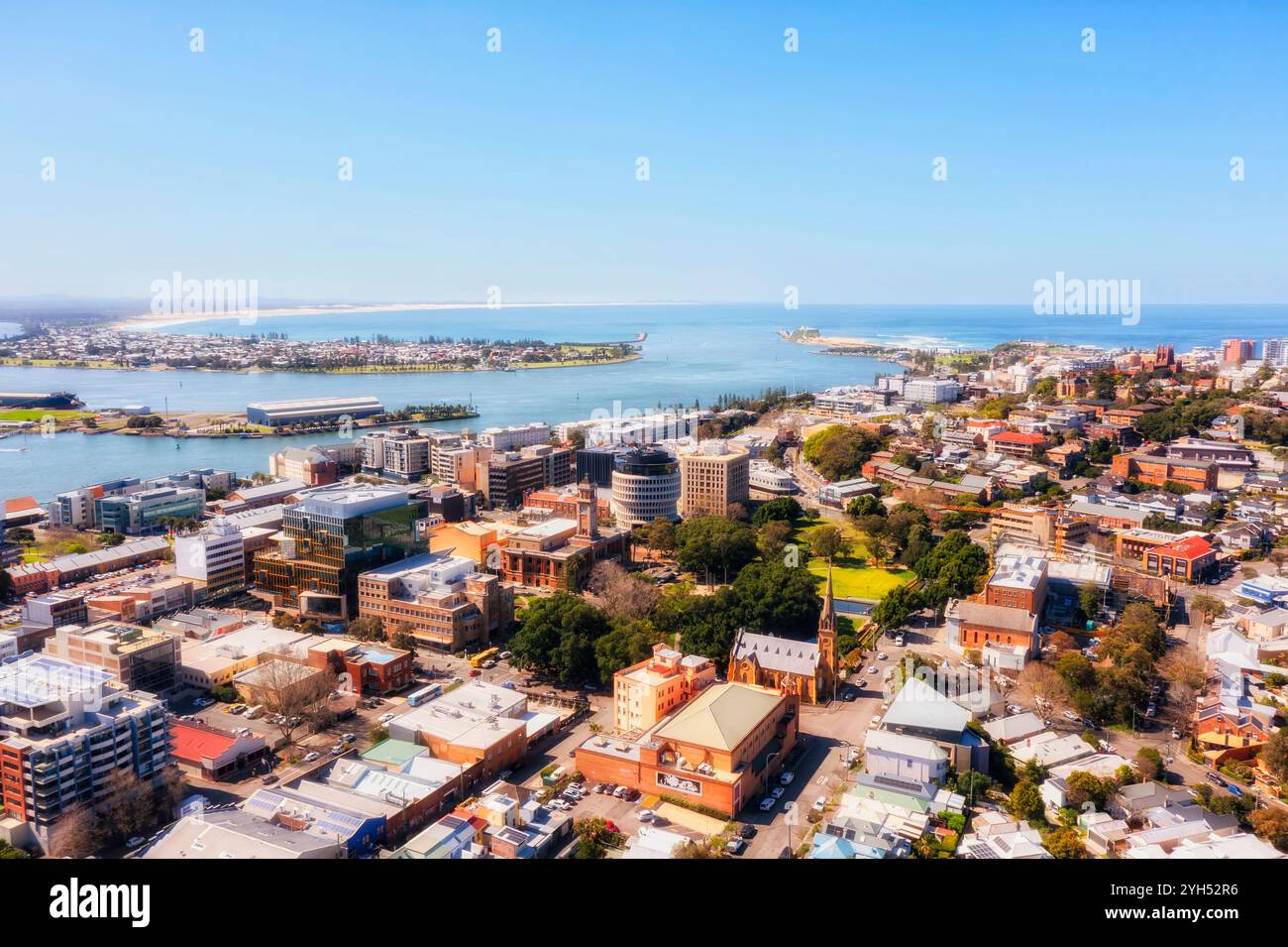 Hunter river entering pacific ocean at Newcastle city CBD in aerial ...