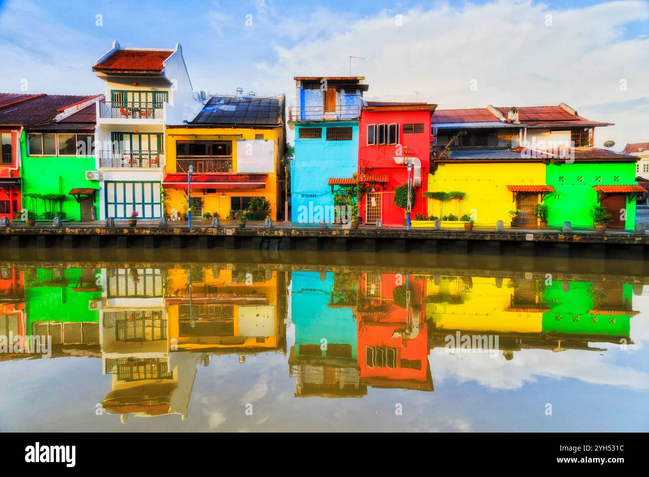 Colourful historic heritage houses on waterfront of Malacca river in Malacca city of Malaysia ...