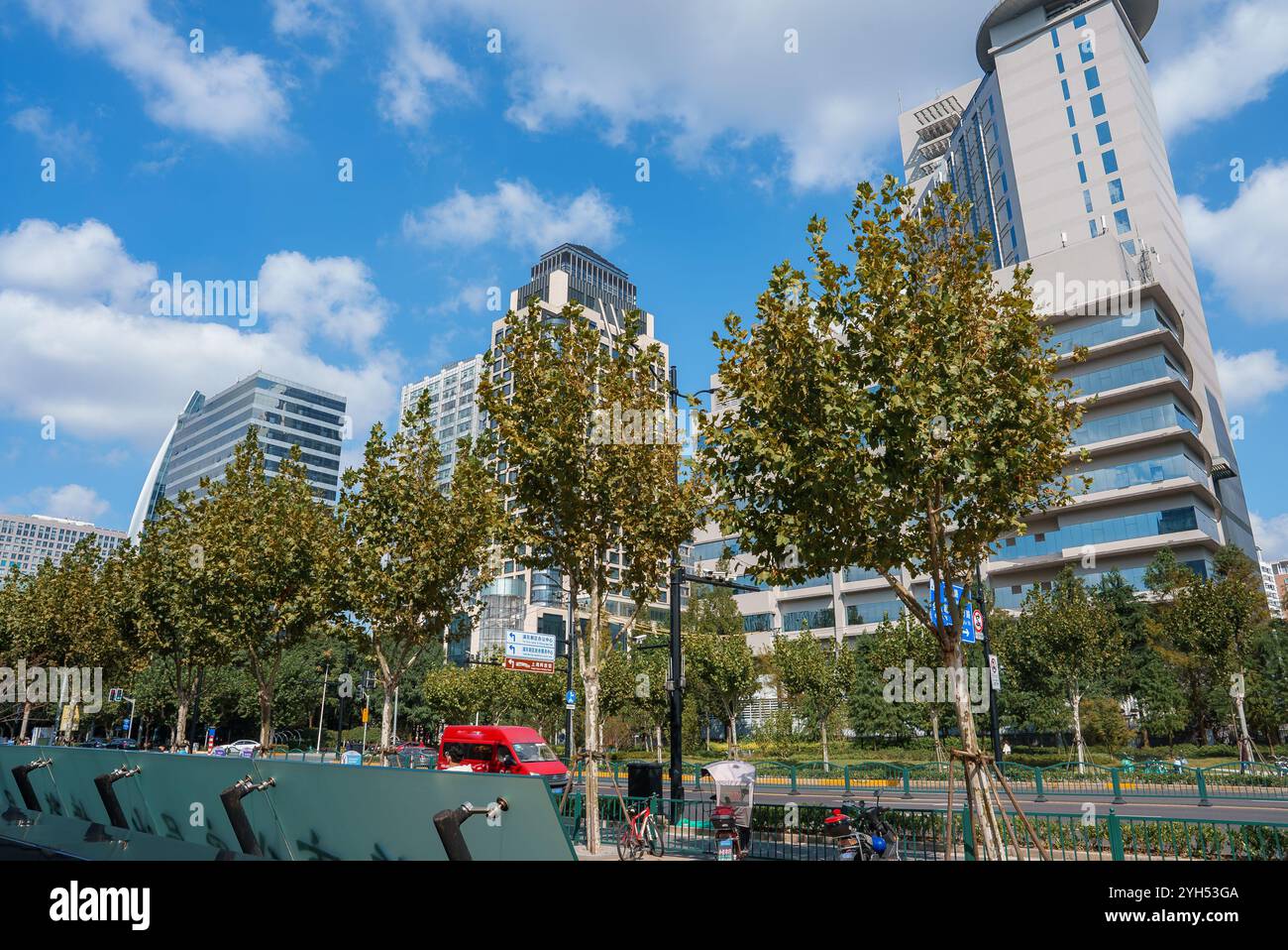 Urban Scene in Shanghai with Skyscrapers and Lush Greenery Stock Photo ...