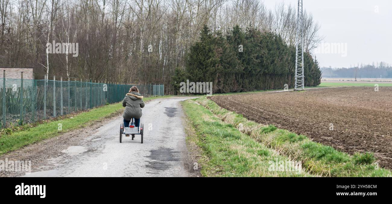 Outdoor portrait of a 37 yo woman with Down Syndrome outdoors, Tienen ...
