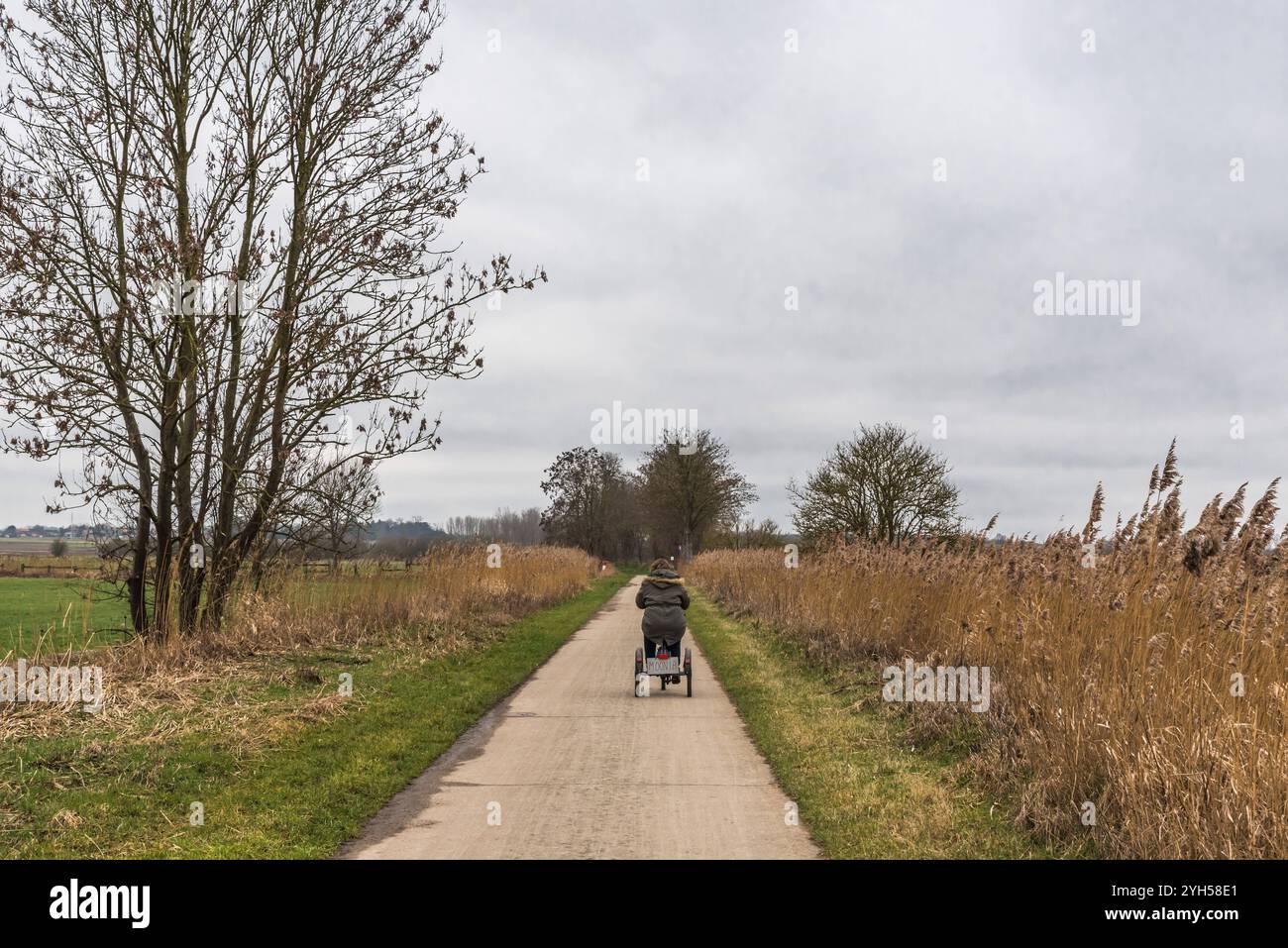 Outdoor portrait of a 37 yo woman with Down Syndrome outdoors, Tienen ...