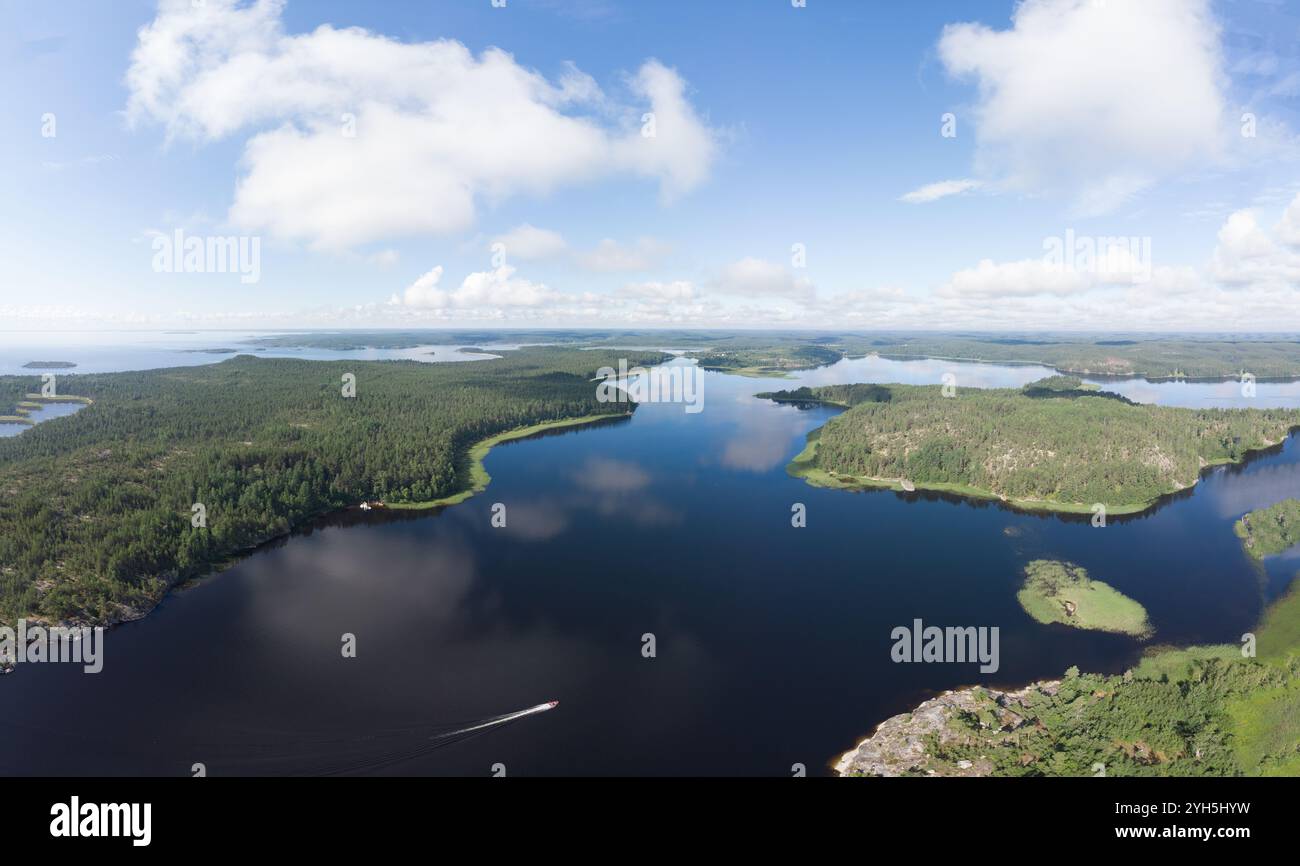 Aerial Top View To Island Kilpola Overgrown With Sparse Trees In Summer