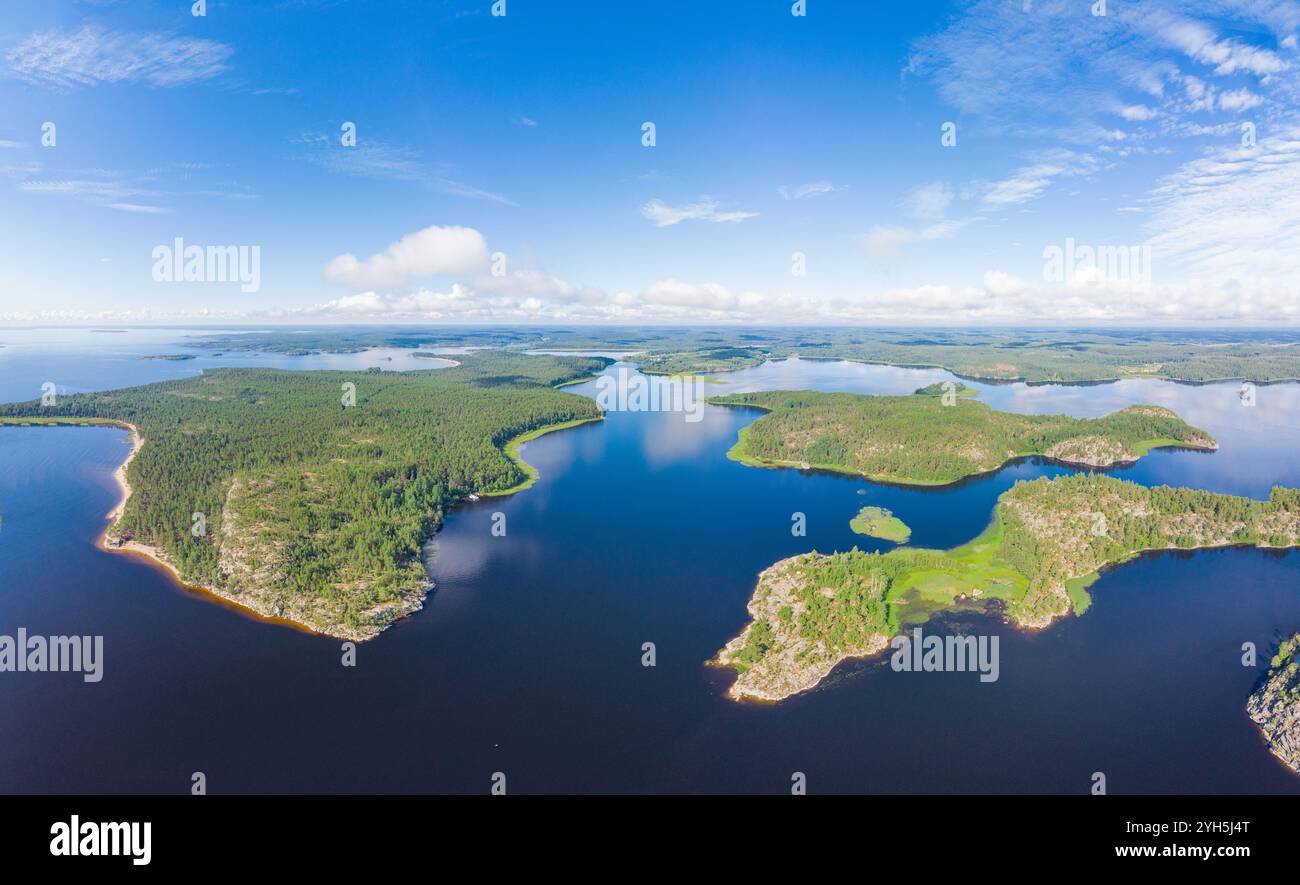 Aerial Top View To Island Kilpola Overgrown With Sparse Trees In Summer