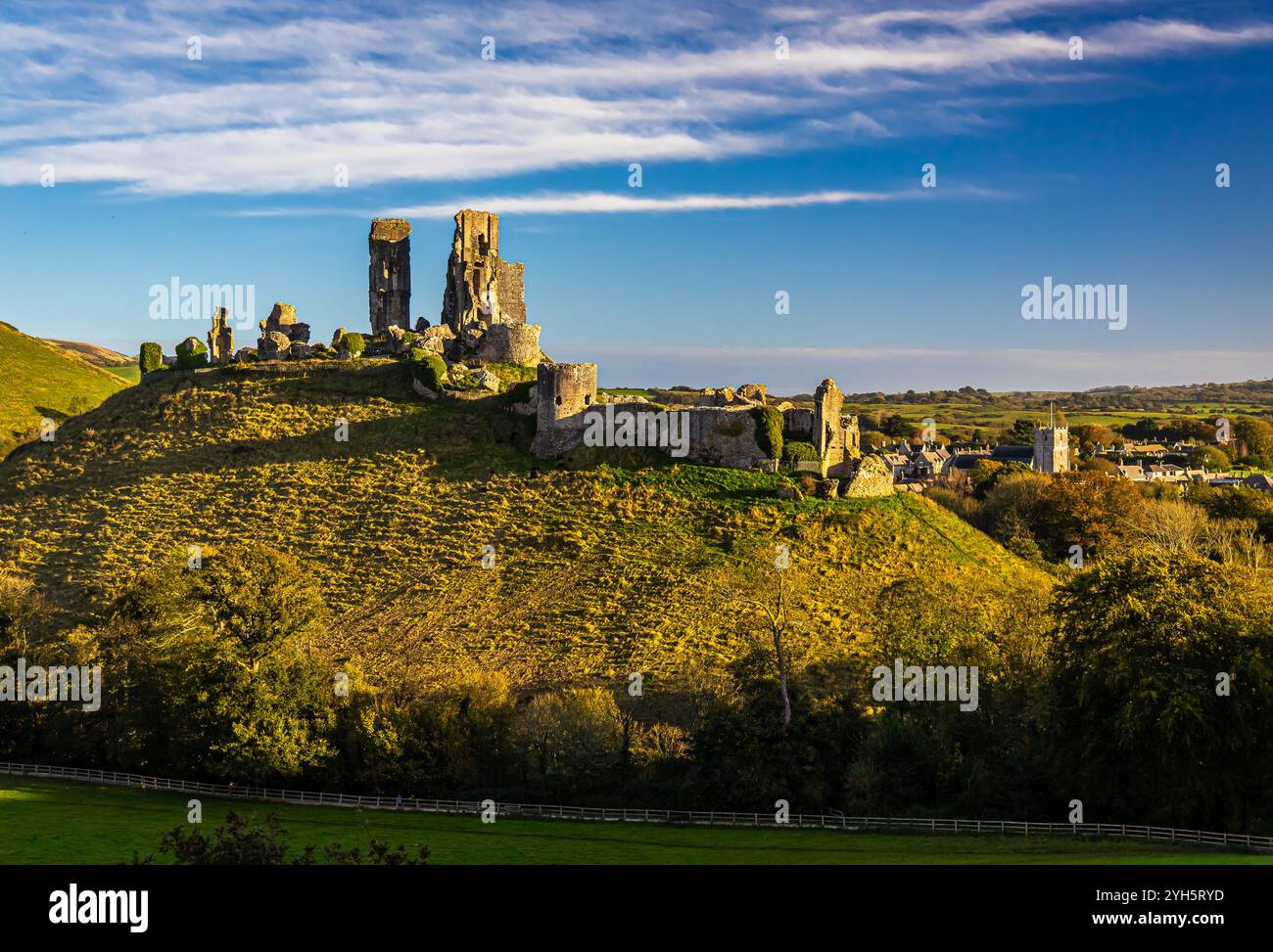 Aerial sunset view of Corfe Castle, a village and civil parish in the ...