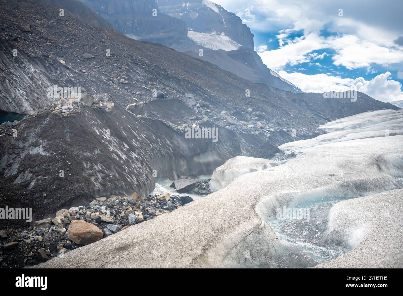 Snow and rock edge of the Athabasca Glacier in Jasper National Park ...