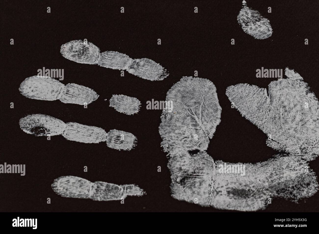 An angled view of a human male handprint on black cardboard Stock Photo ...