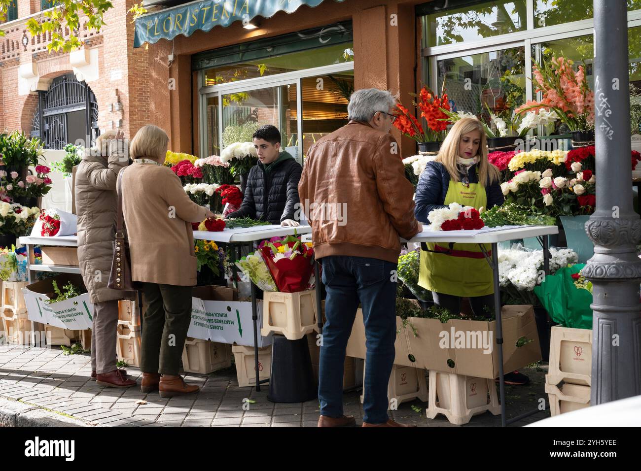 Vendors arrange flowers for visitors at the northern gate of Our Lady ...