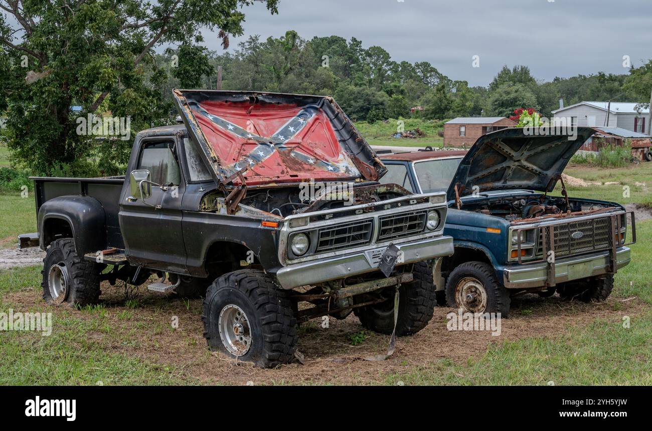 Two Ford pickup trucks with painted confederate flag Stock Photo - Alamy