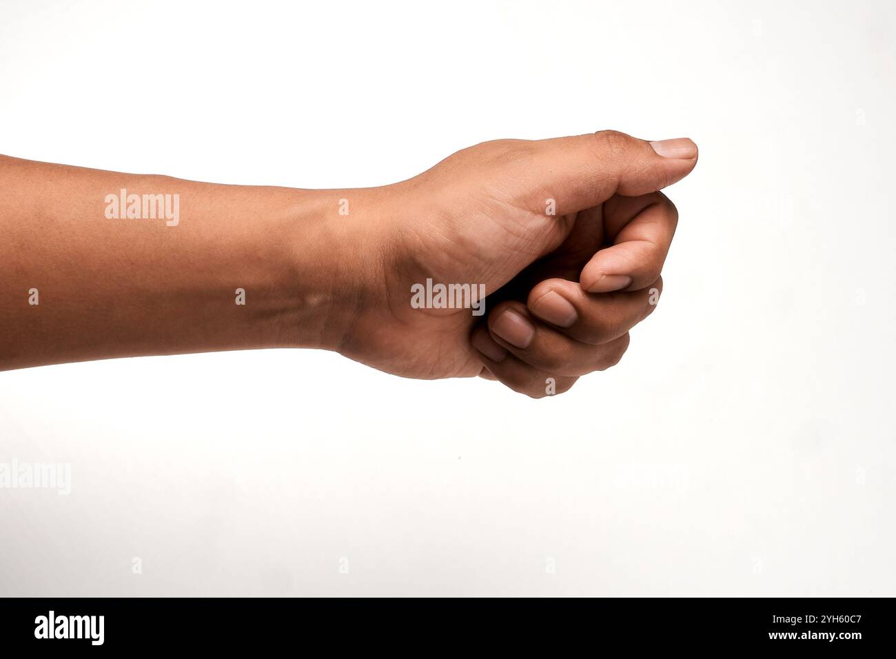 Hand of a Latino man holding something, partially closed in the shape ...