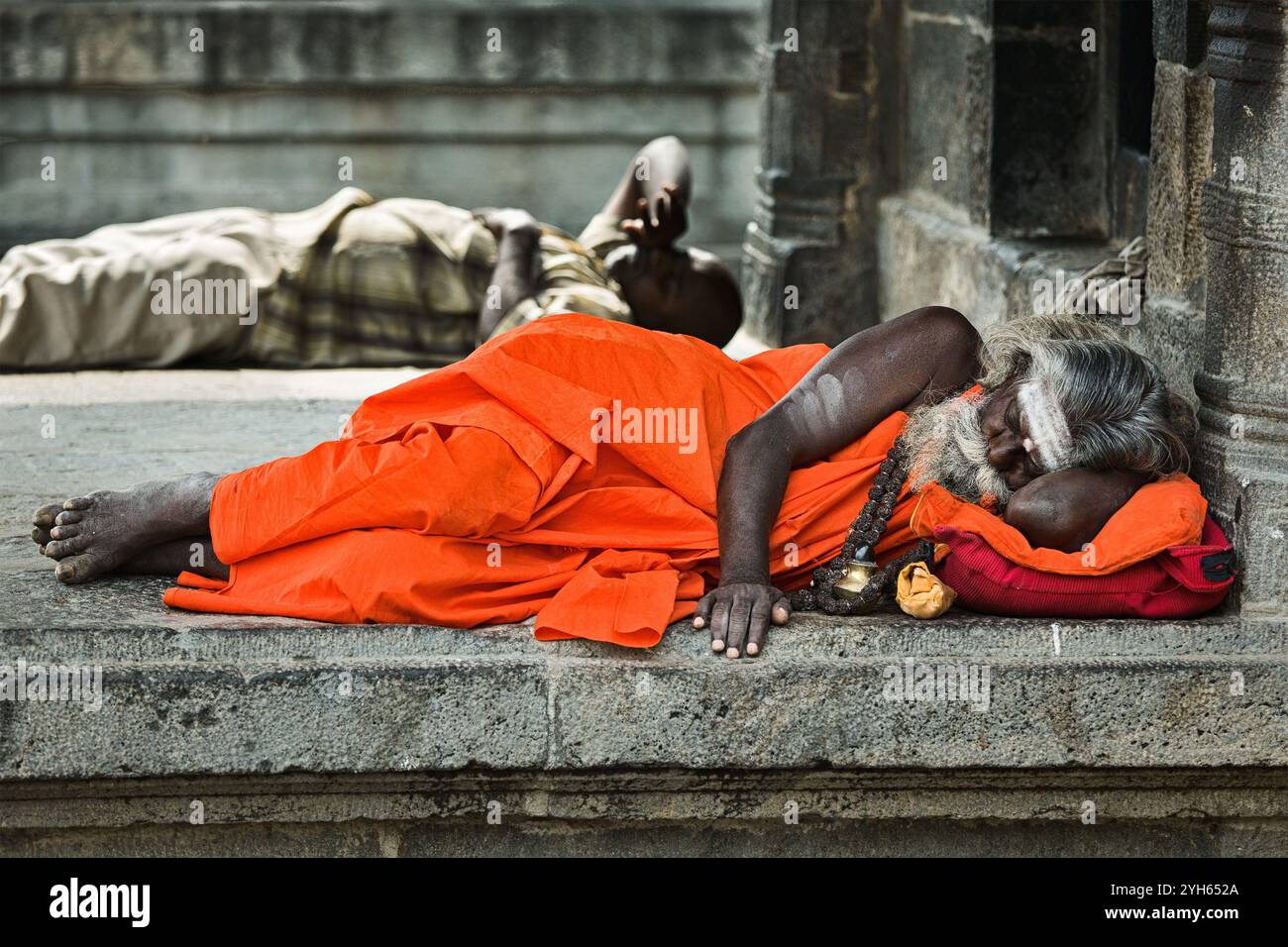 Sadhu sleeping in temple Stock Photo - Alamy