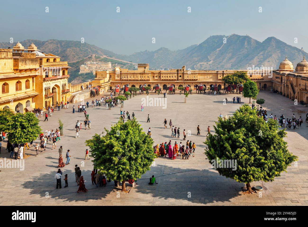 ourists visiting Amer Amber fort, Rajasthan, India. Amer fort is famous ...