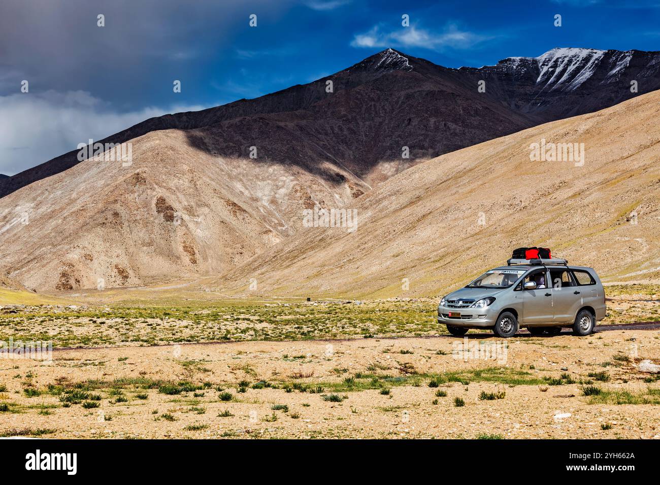 Modern MPV car on road in Himalayas mountains Stock Photo - Alamy