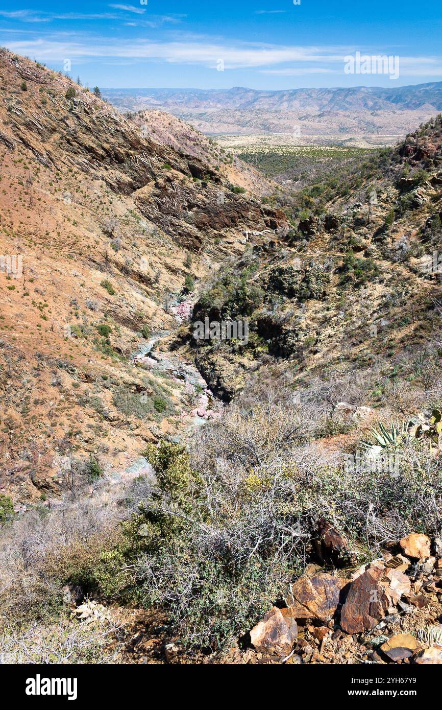The dry drainage below the Barnhardt Trail winding through the base of ...
