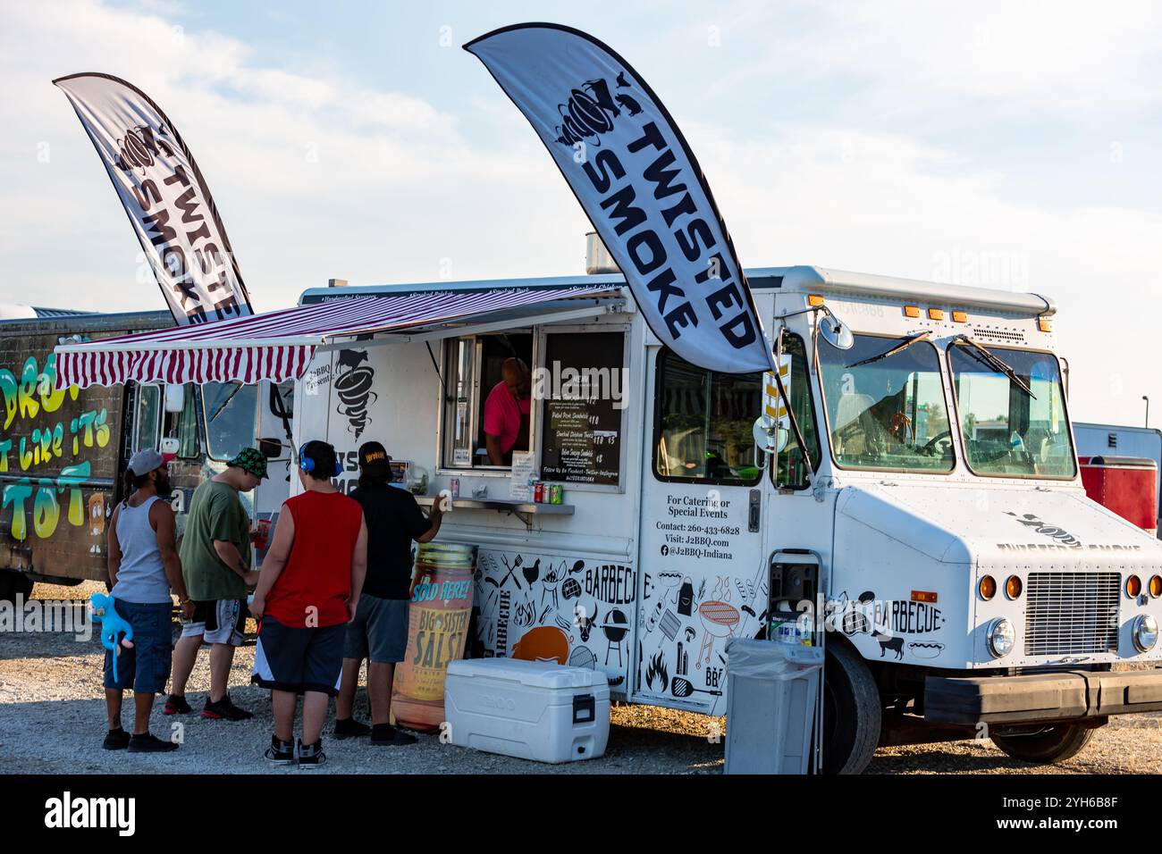 The white Twisted Smoke food truck parked in downtown Fort Wayne ...