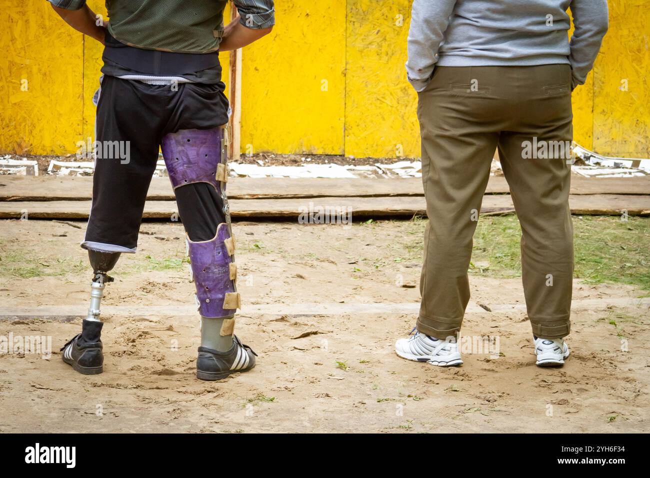 Sports and people with disabilities. A man without a leg throws knives ...