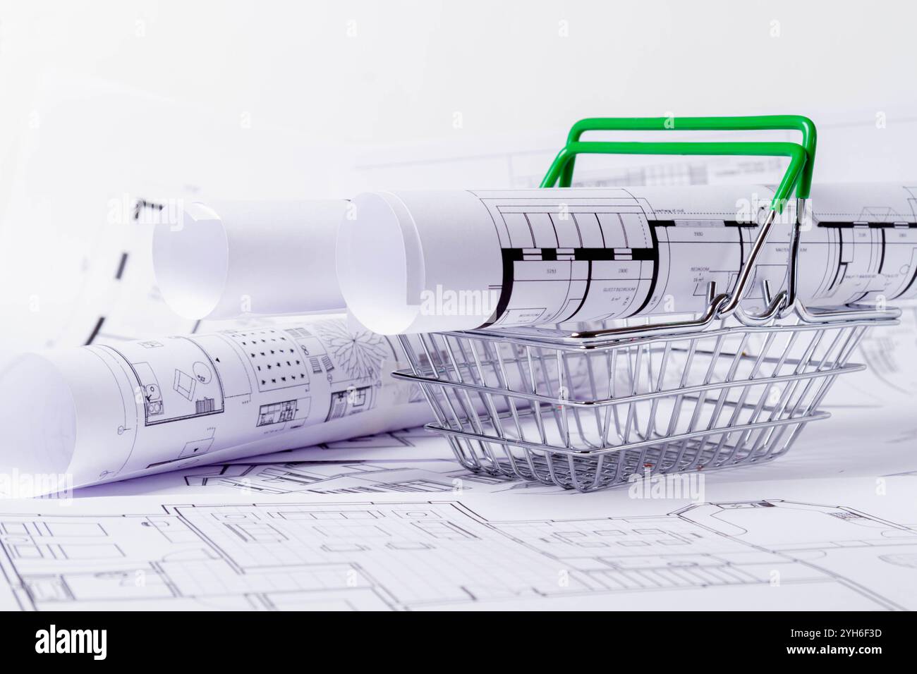 Construction plan in grocery basket. House design project. Miniature ...