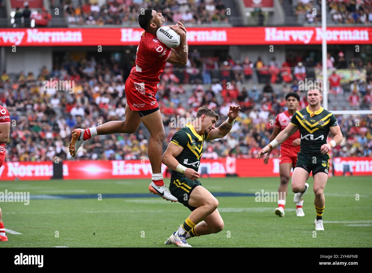 Sydney, Australia. 10th Nov, 2024. Daniel Tupou of Tonga takes the high ball over Zac Lomax of ...