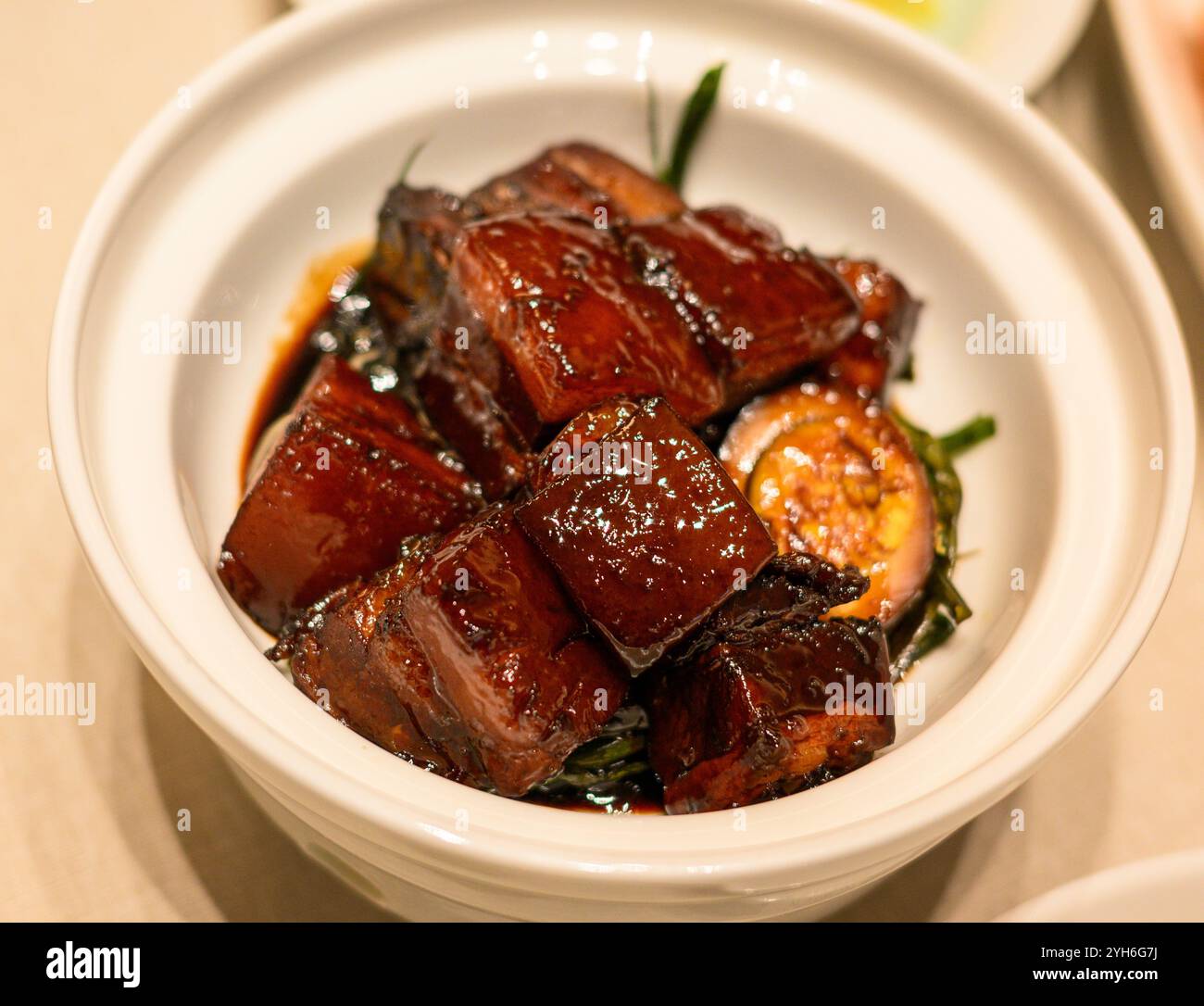 Mouth watering braised pork belly (Hong Shao Rou in Chinese) in a pot ...