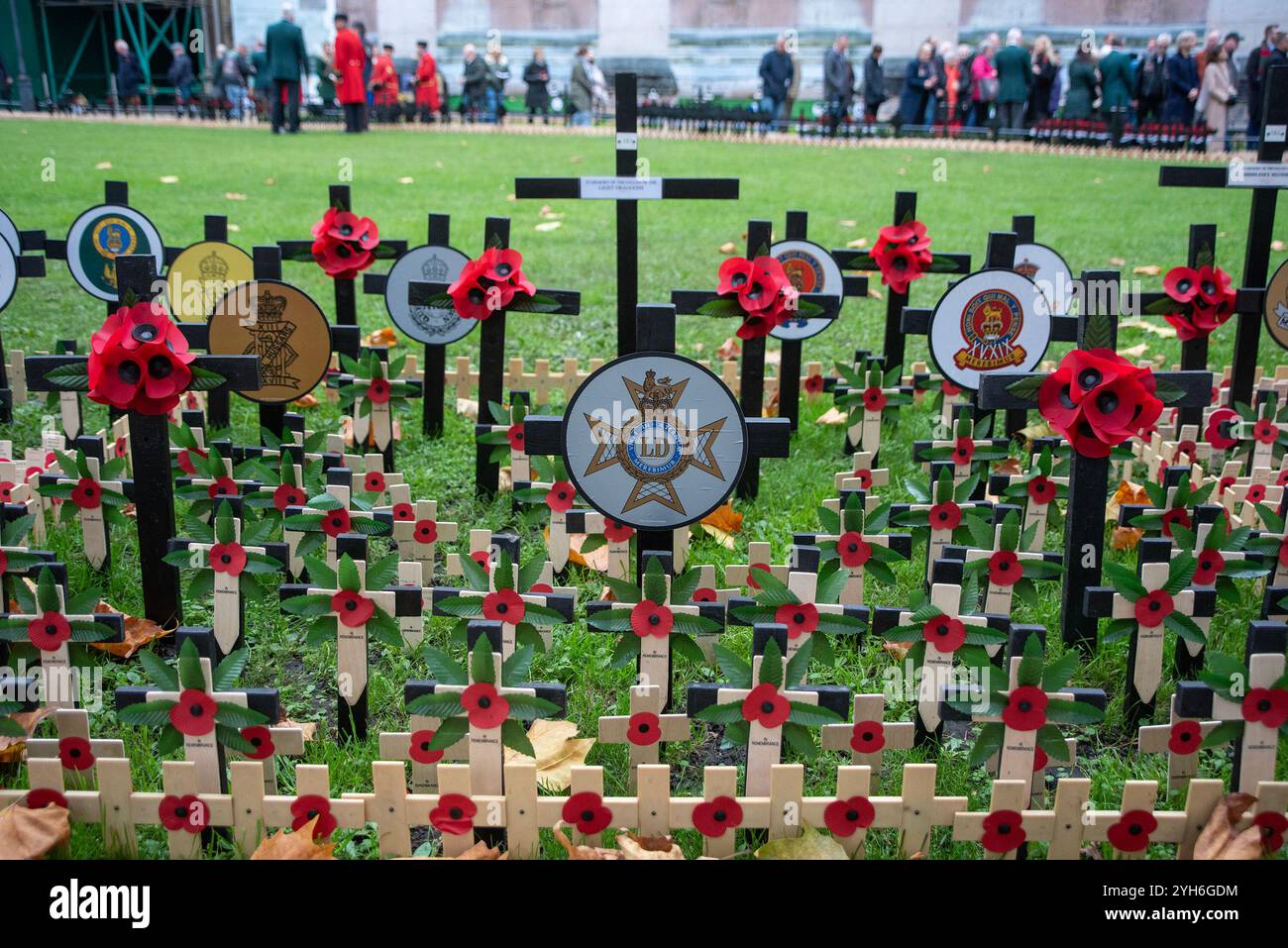 People walk and chat after the ceremony at the Field of Remembrance at ...