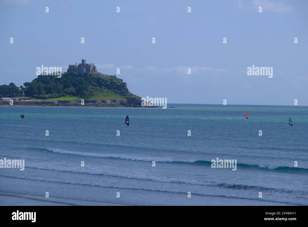 Catching waves near St Michaels Mount Stock Photo - Alamy