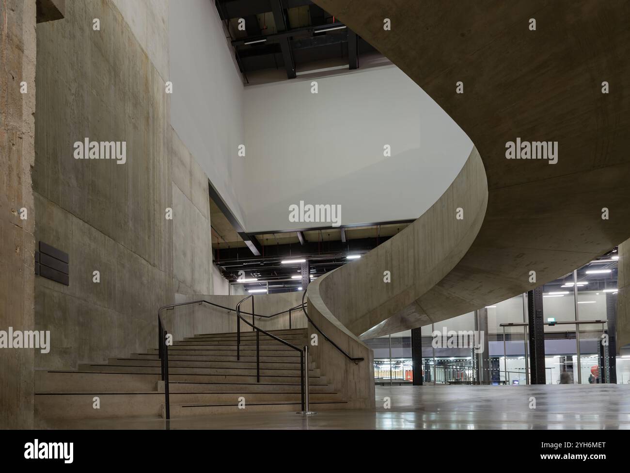 London, UK - Nov 07, 2023 - A curving flight concrete spiral staircase ...