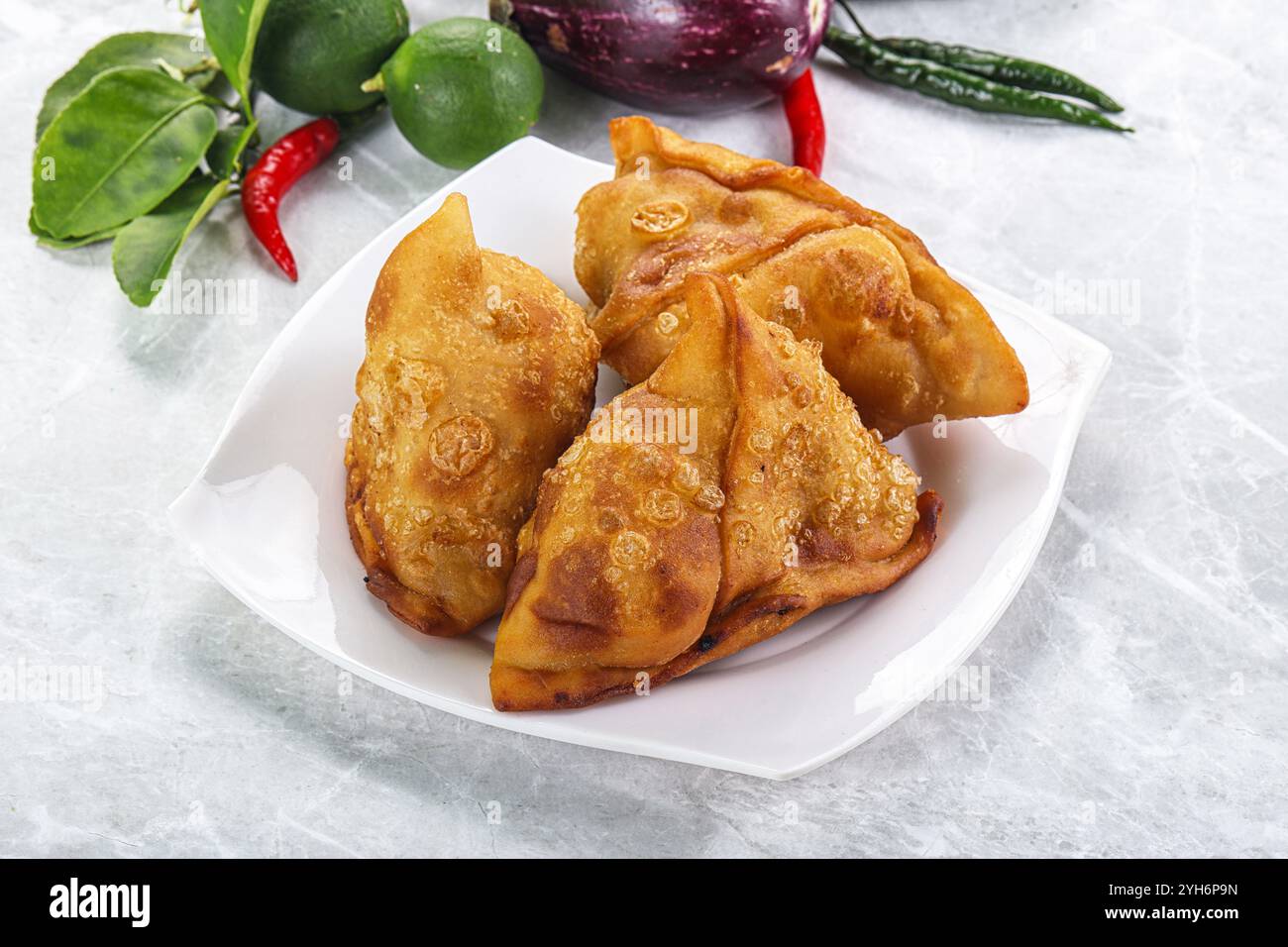 Indian cuisine - fries crispy stuffed samosa Stock Photo - Alamy