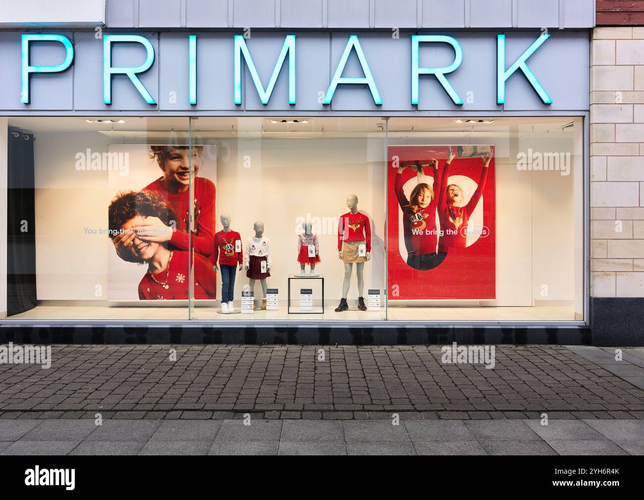Christmas clothes in the window display at Primark clothing shop in the ...