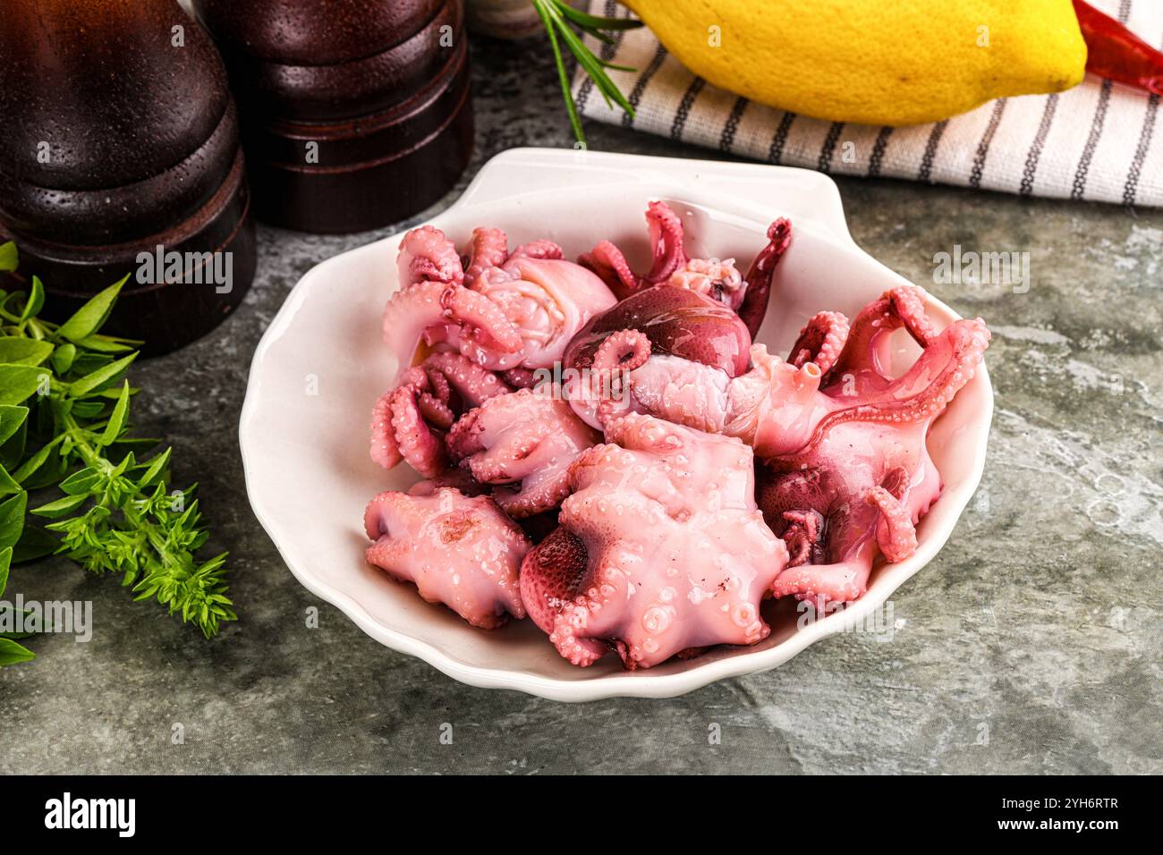 Marinated baby octopus snack appetizer served lemon Stock Photo - Alamy
