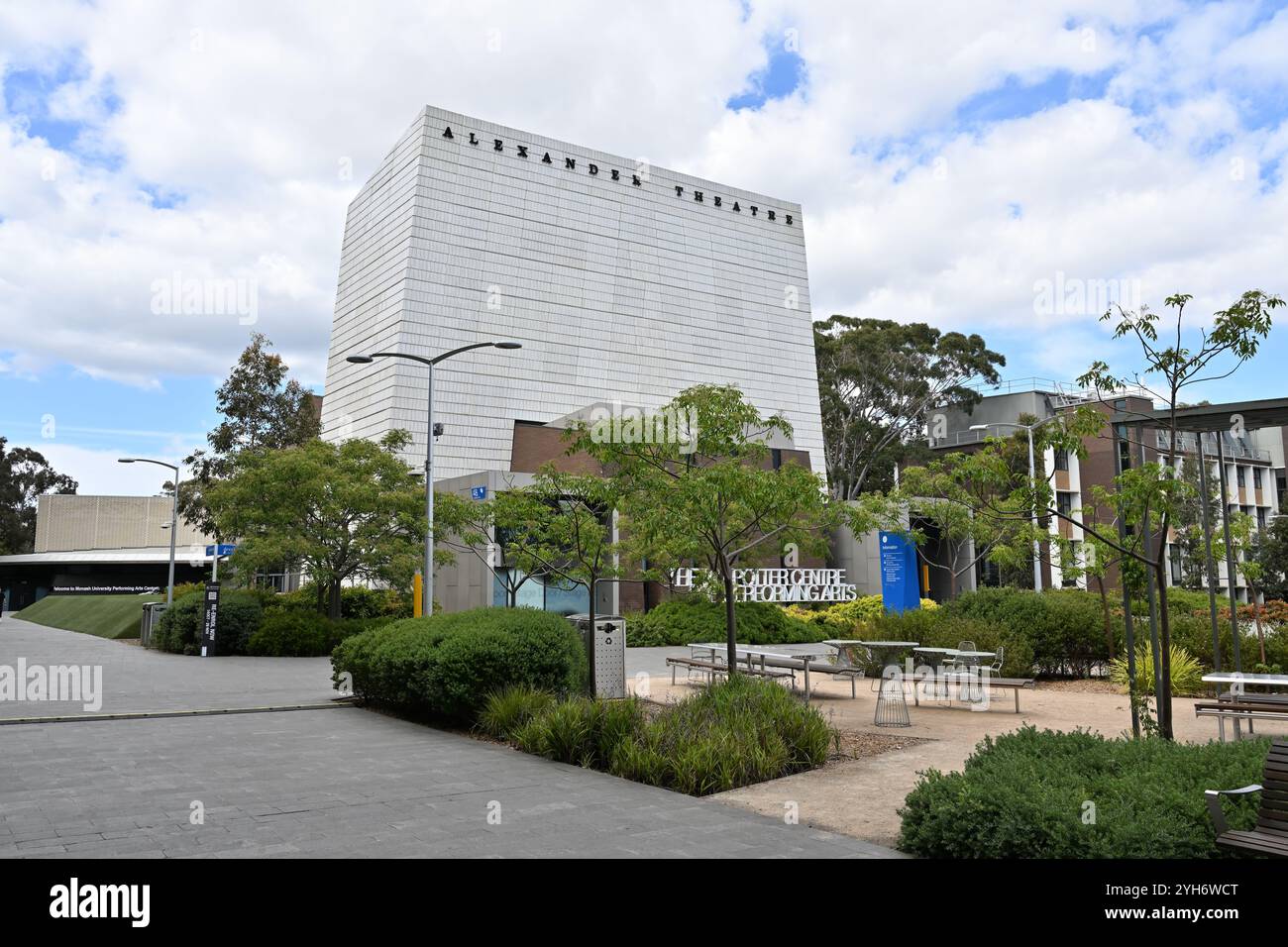 Tall white Alexander Theatre building towering over the neat green ...