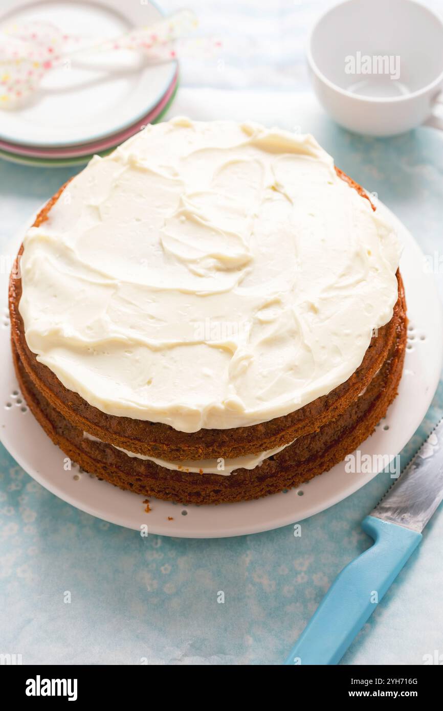 Carrot cake with icing layered Stock Photo - Alamy