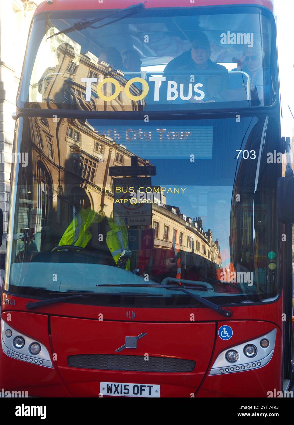 Red open top Toot tourist bus with some of Bath's Georgian stone ...