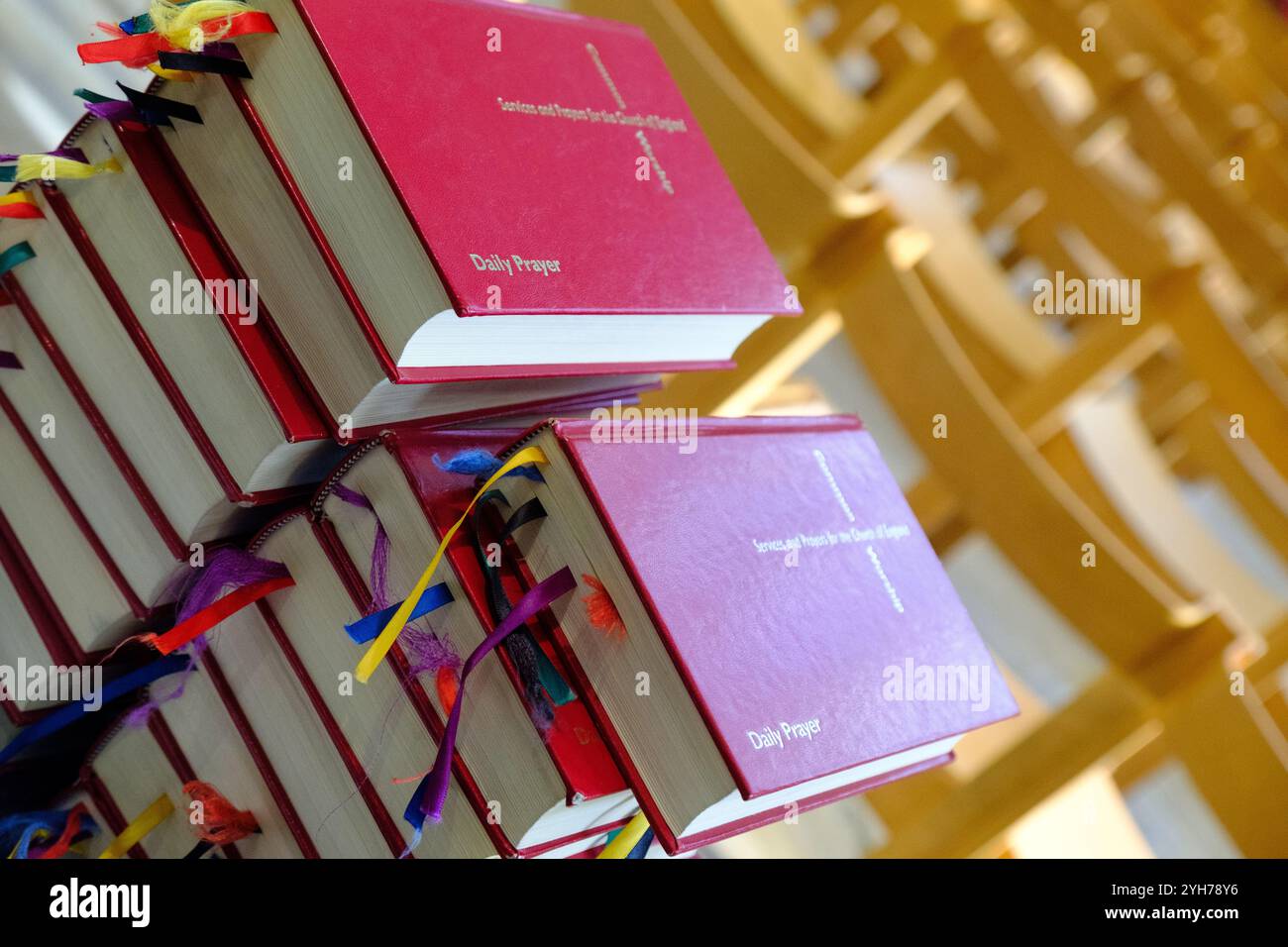 Stacked red bibles in a cathedral Stock Photo - Alamy