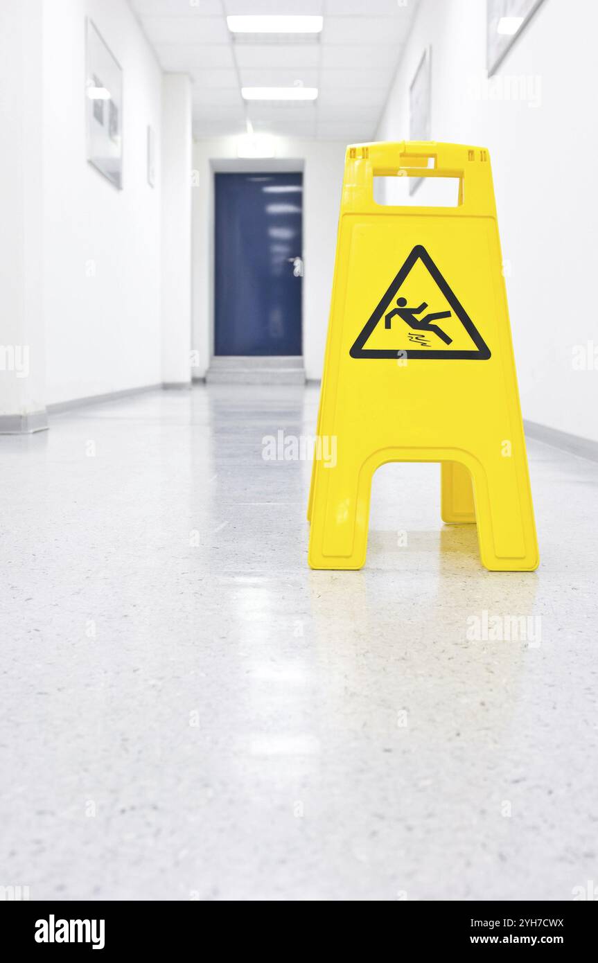 Warning sign Caution, danger of slipping in a corridor, Federal ...