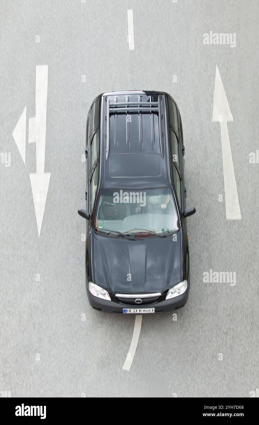 Car from above between lane direction arrows, Federal Republic of ...