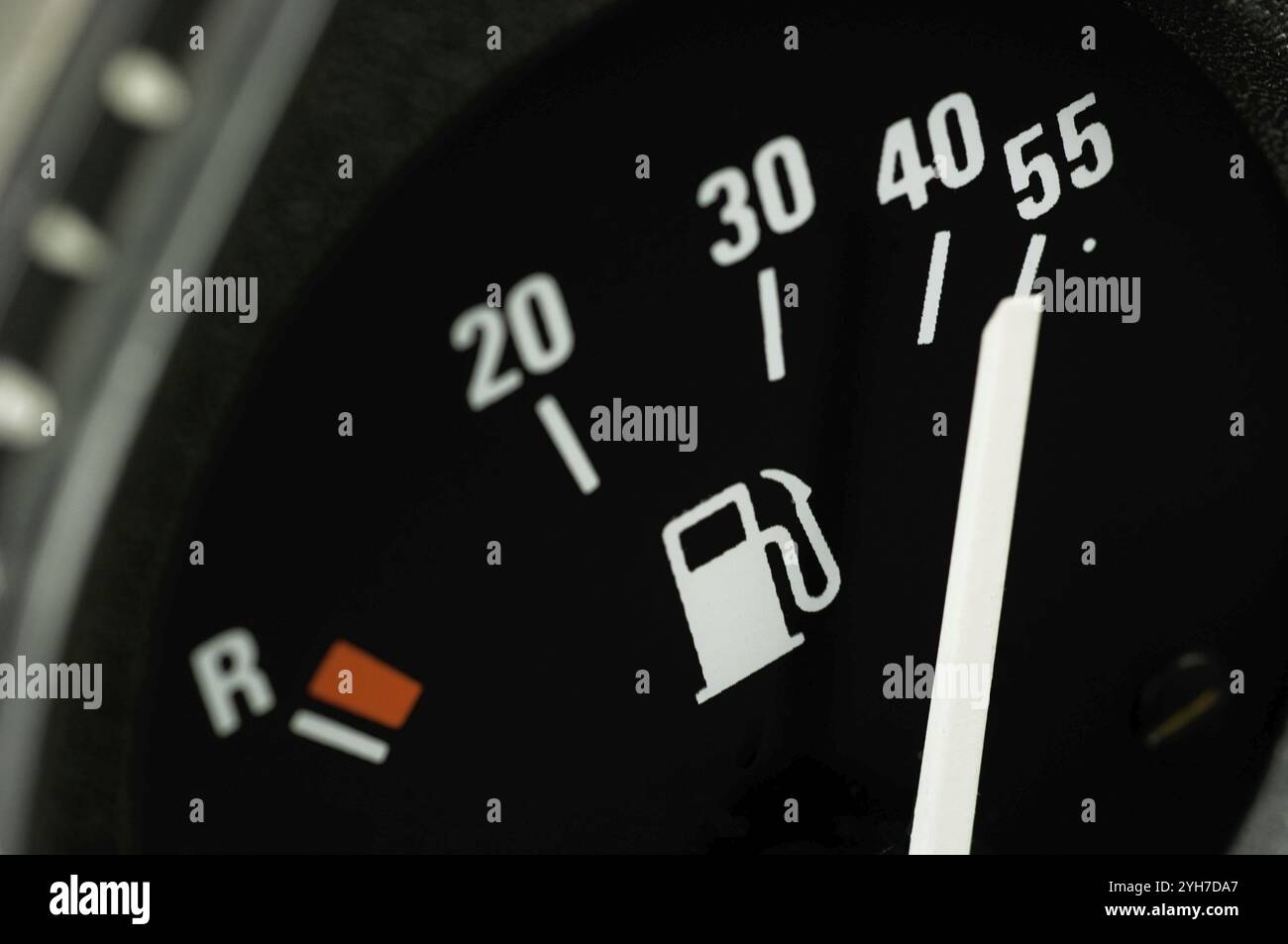 Fuel gauge in a car in the full tank position. The litres, reserve mark ...